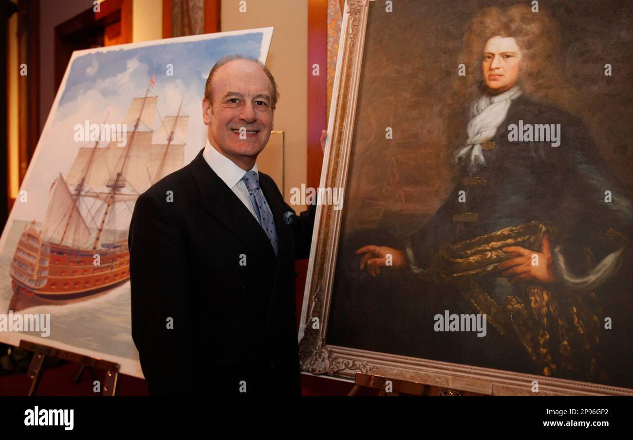 Sir Robert Balchin stands by a painting of his ancestor Admiral John ...