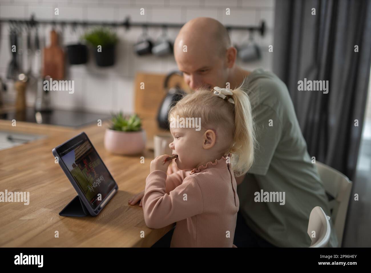 Deaf child girl with cochlear implant studying to hear sounds and have ...