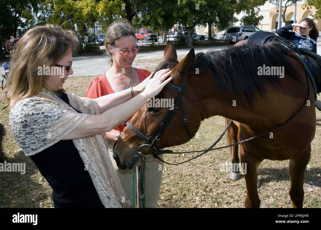 Rabbi Jody Cohen, left, of Temple Israel, blesses "Tigger" a 22-year ...