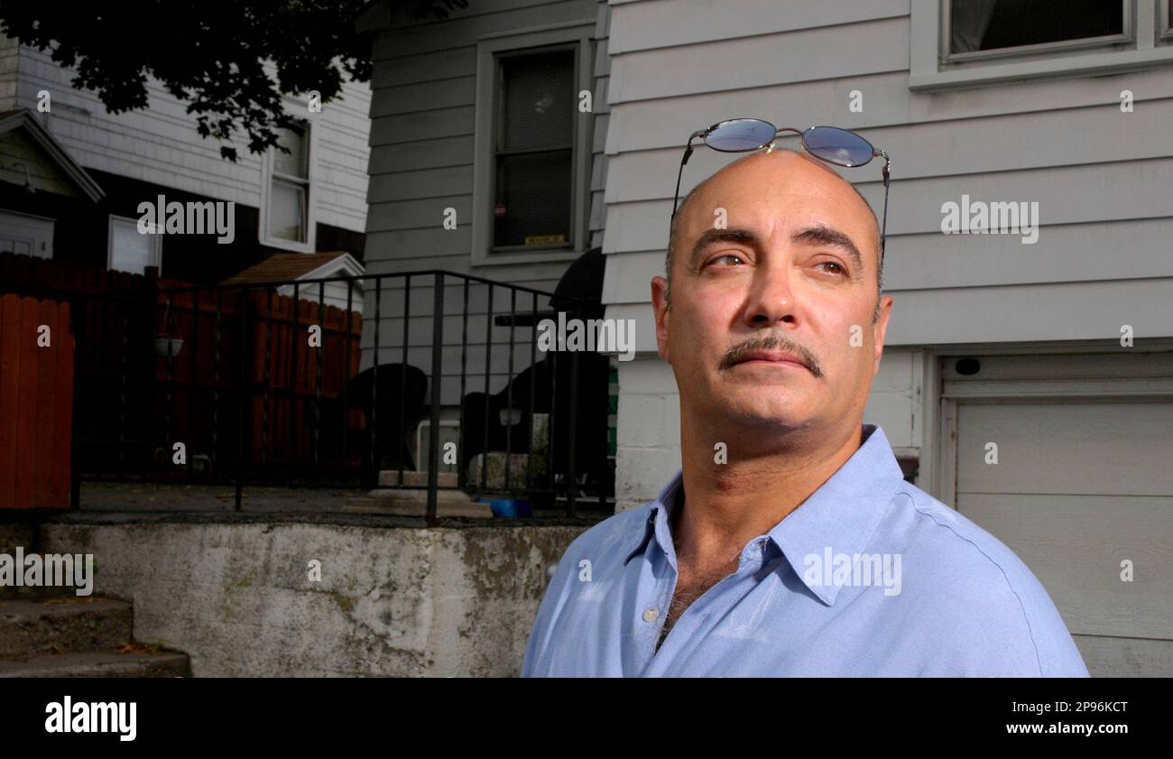 Tony Messina poses for a portrait outside his home in Syracuse, N.Y ...
