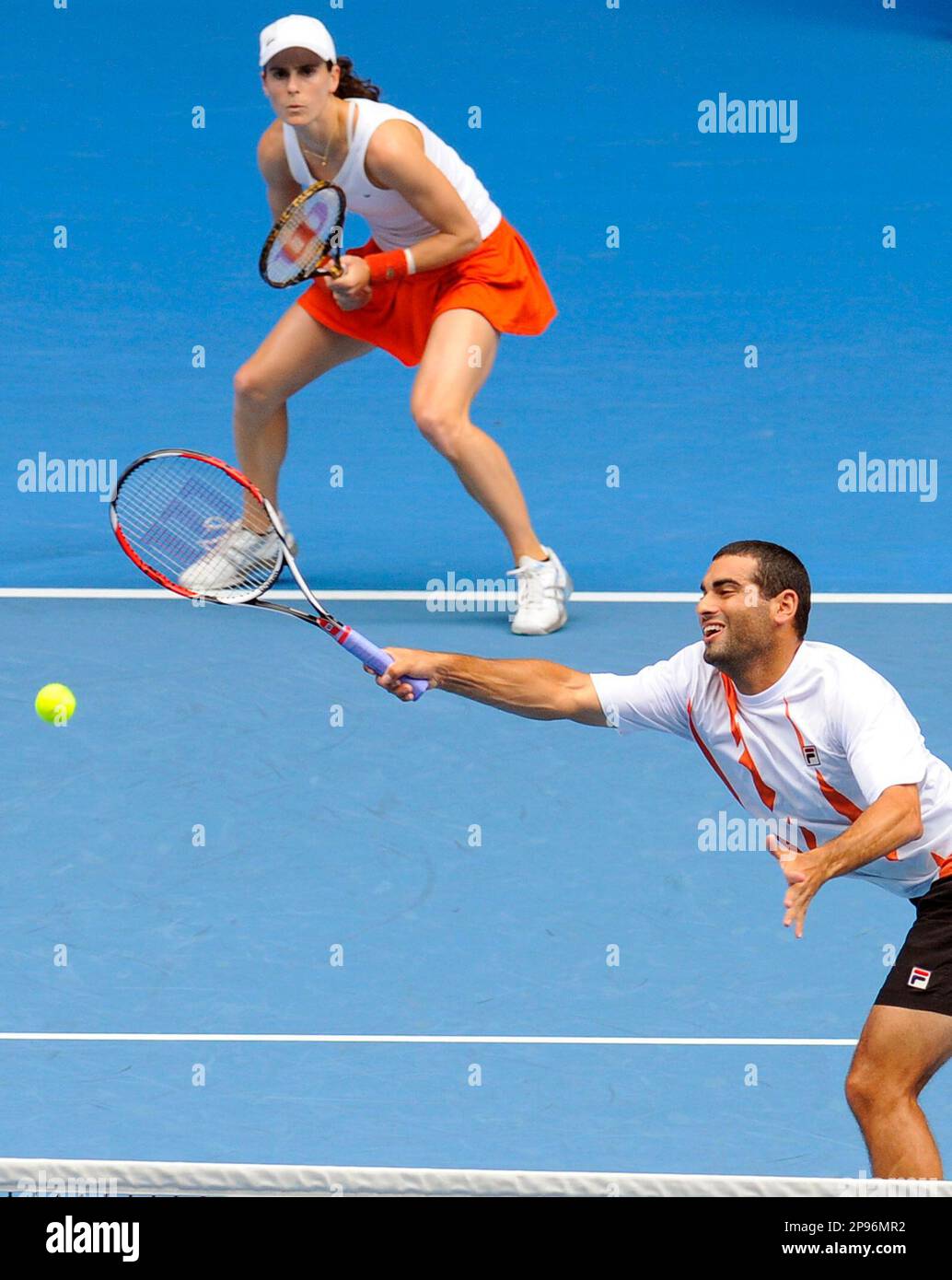 France's Nathalie Dechy, top, and Israel's Andy Ram play India's Sania ...