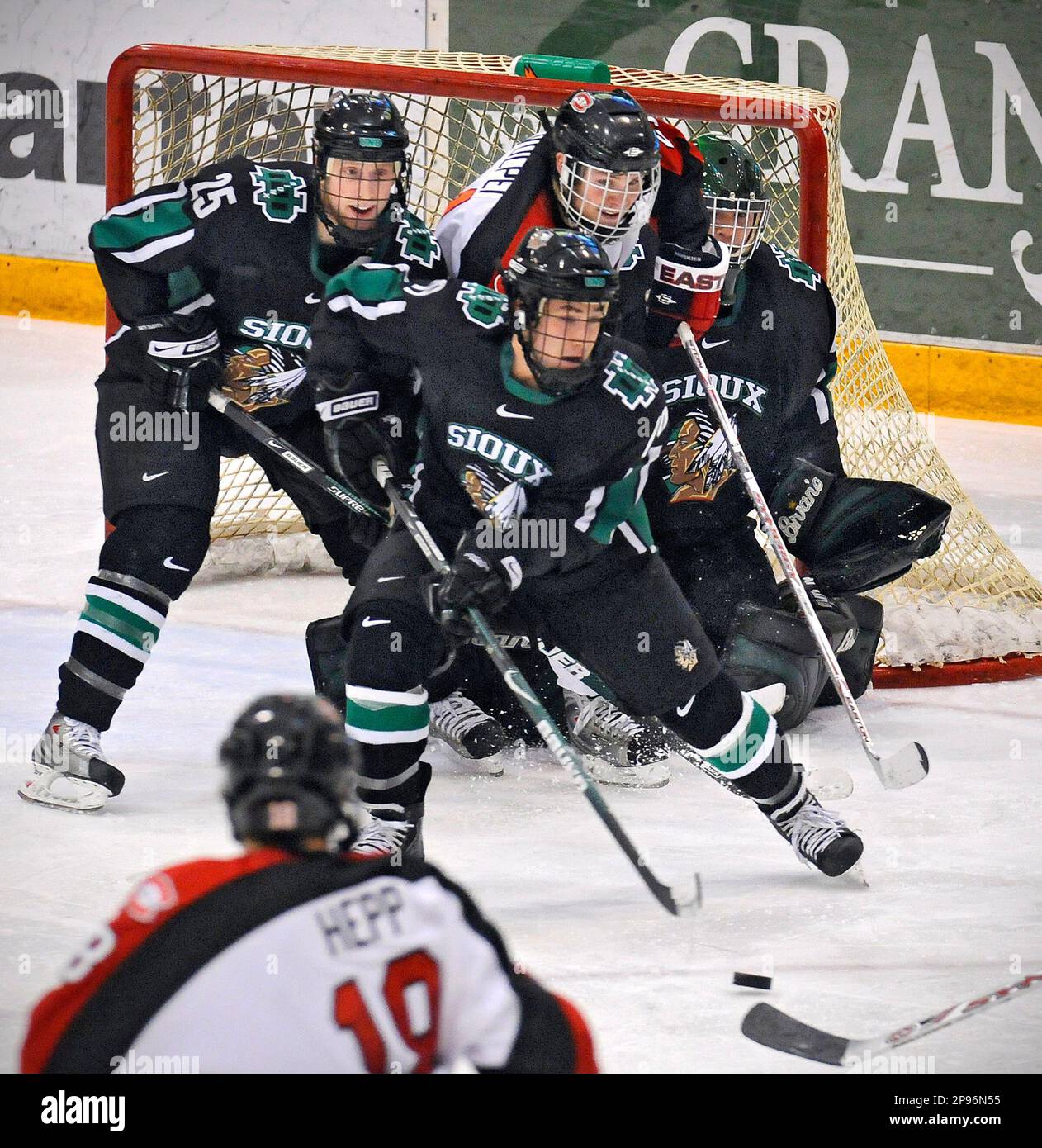 St. Cloud State's Brian Volpei, center, is surrounded by North Dakota ...