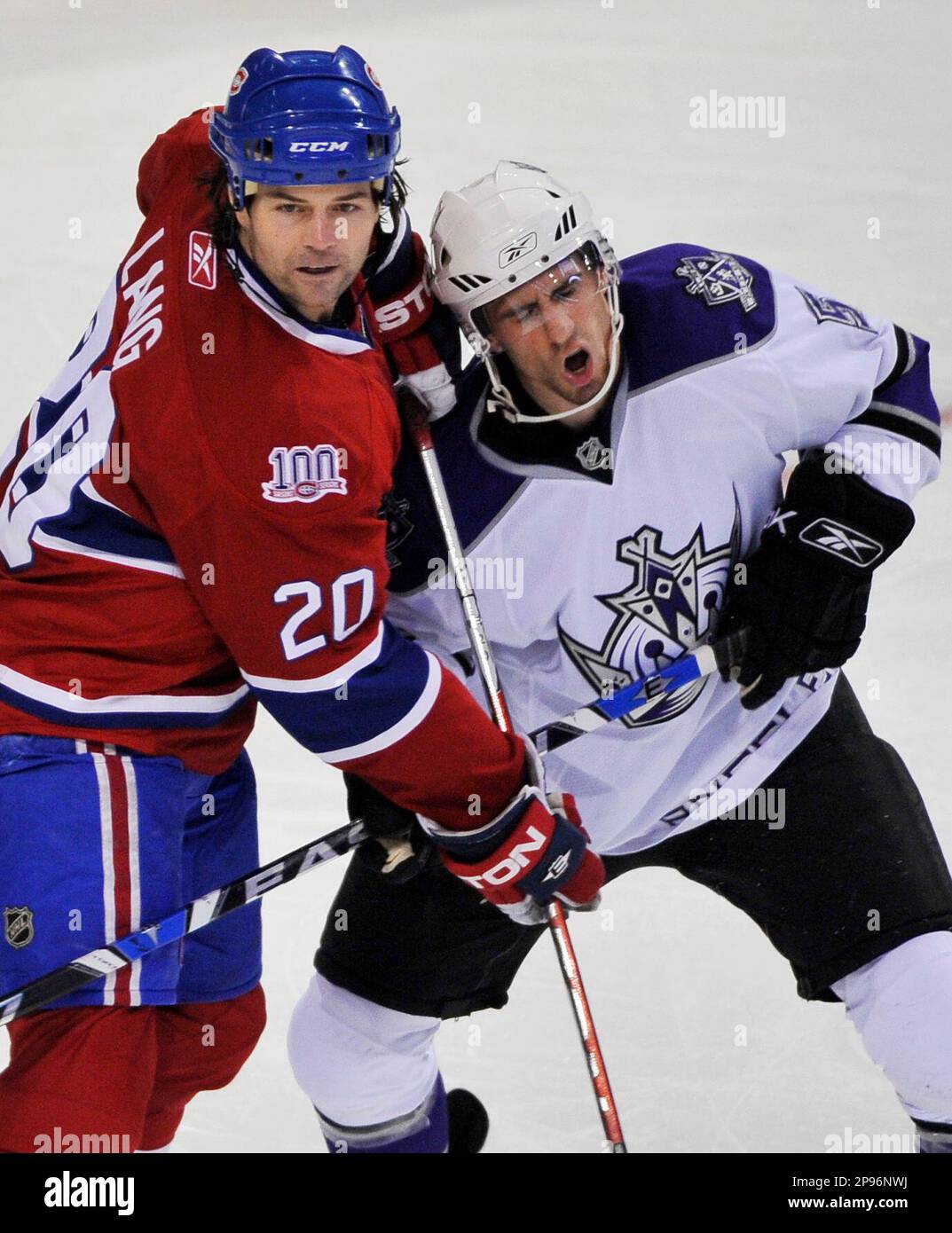 Montreal Canadiens' Robert Lang, left, checks, Los Angeles Kings' Peter ...