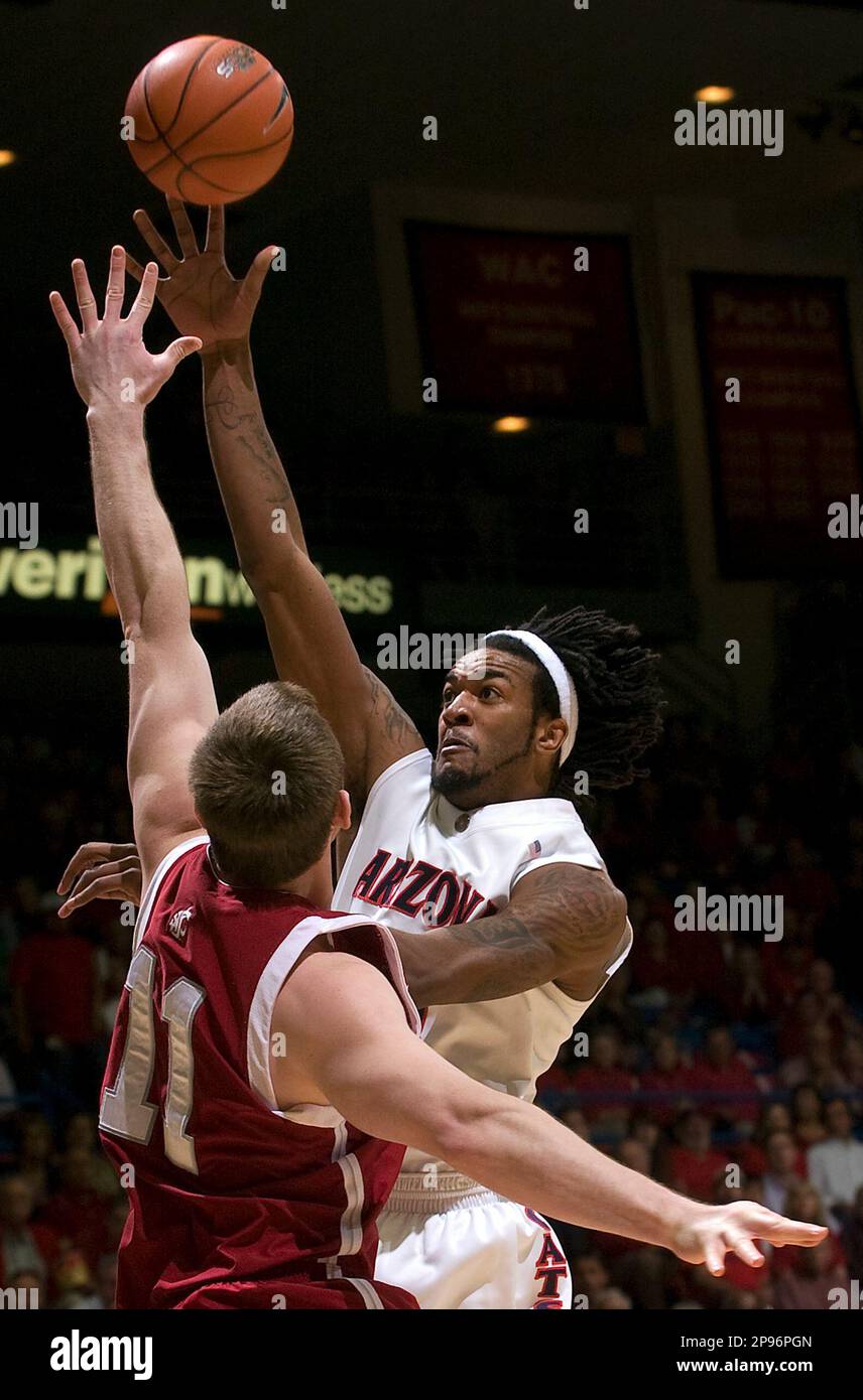 Arizona's Jordan Hill, right, shoots for two over Washington State's ...