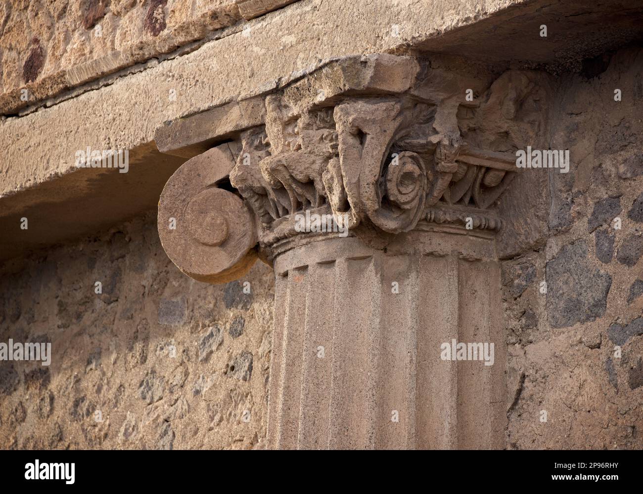 Detail of a fluted, stone column and Ionic capital with volutes at ...