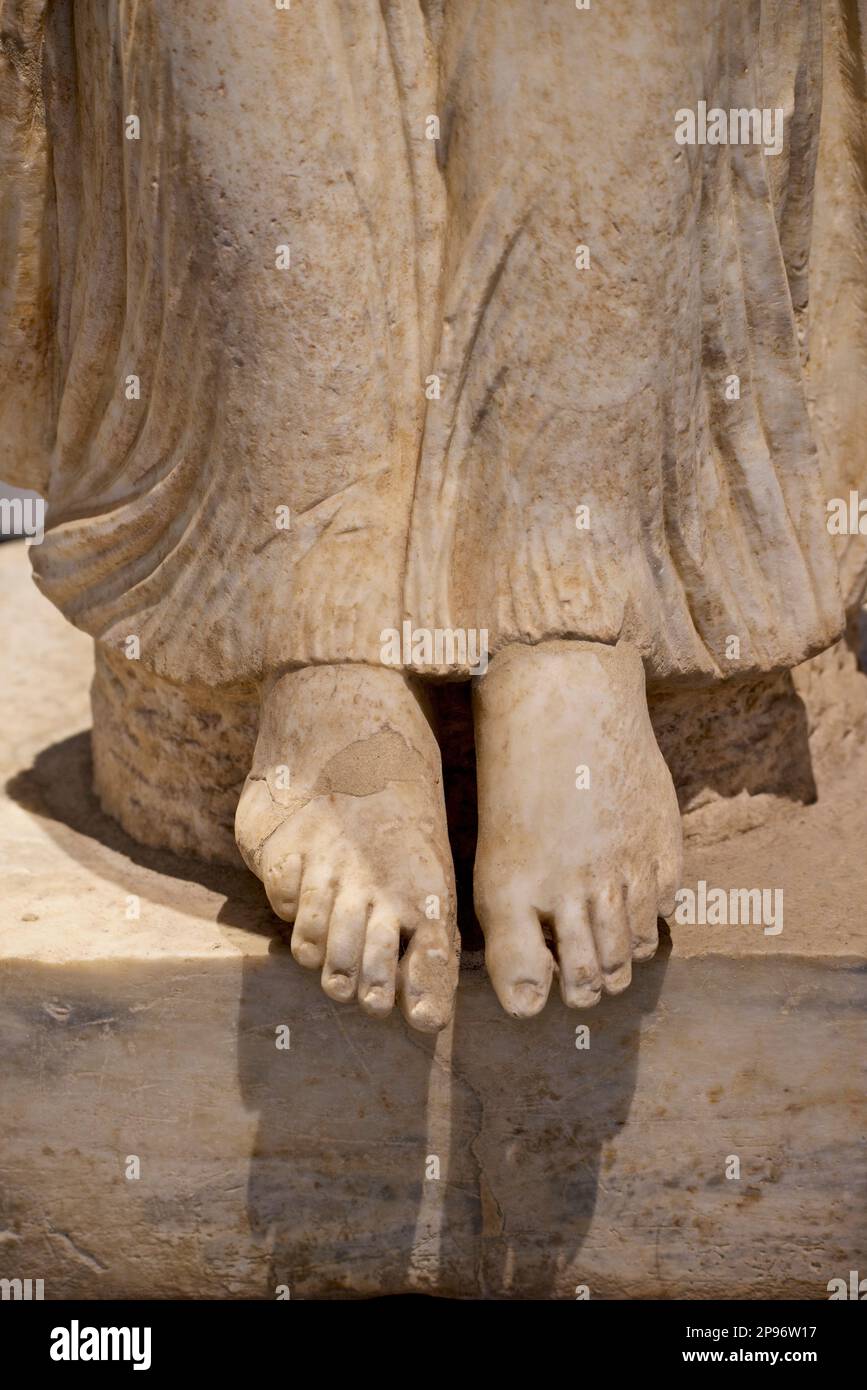 Detail of Roman sculpture of a woman. Detail of feet. excavated from ...