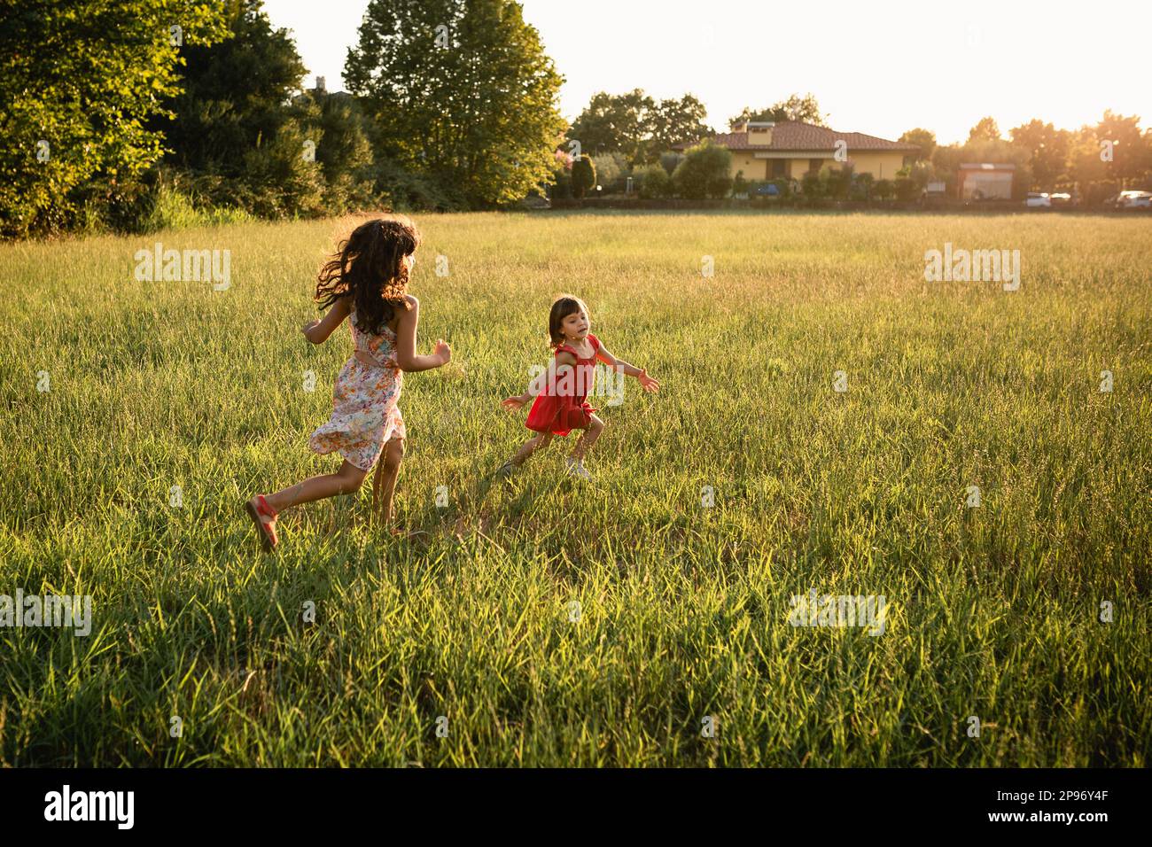 Girls in dresses running hi-res stock photography and images - Alamy