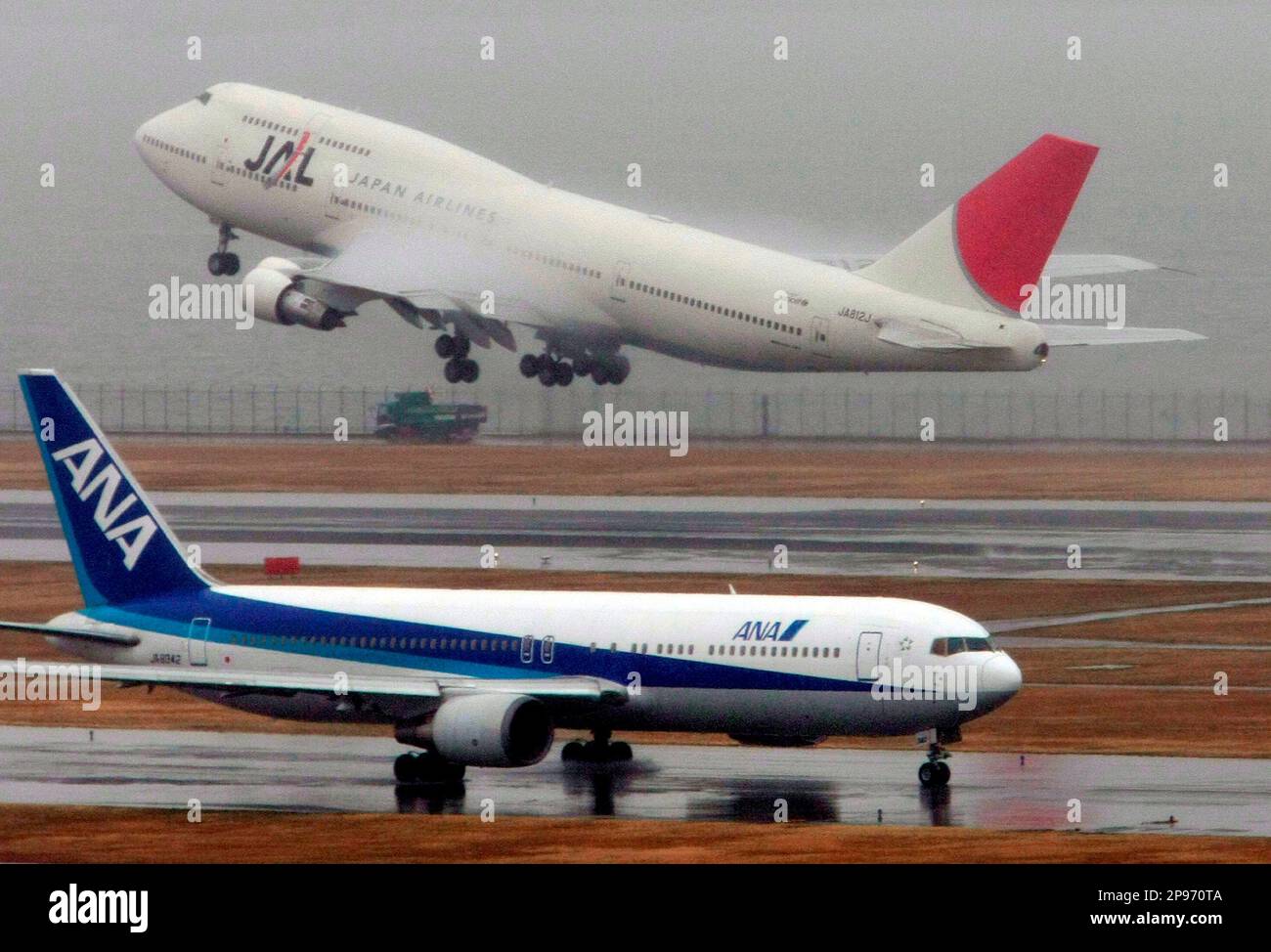 A biofuel-loaded Japan Airlines (JAL) Boeing 747-300 jet takes off from Haneda Airport in Tokyo ...