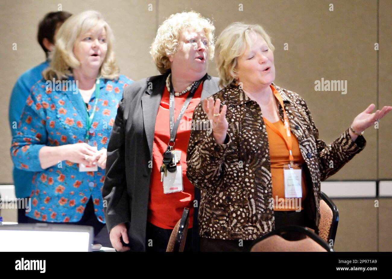 Female pastors sing during a service at a United Methodist Church ...