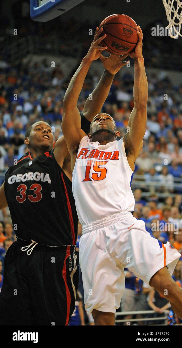 Florida's Walter Hodge (15) goes for two points with Georgia's Trey ...