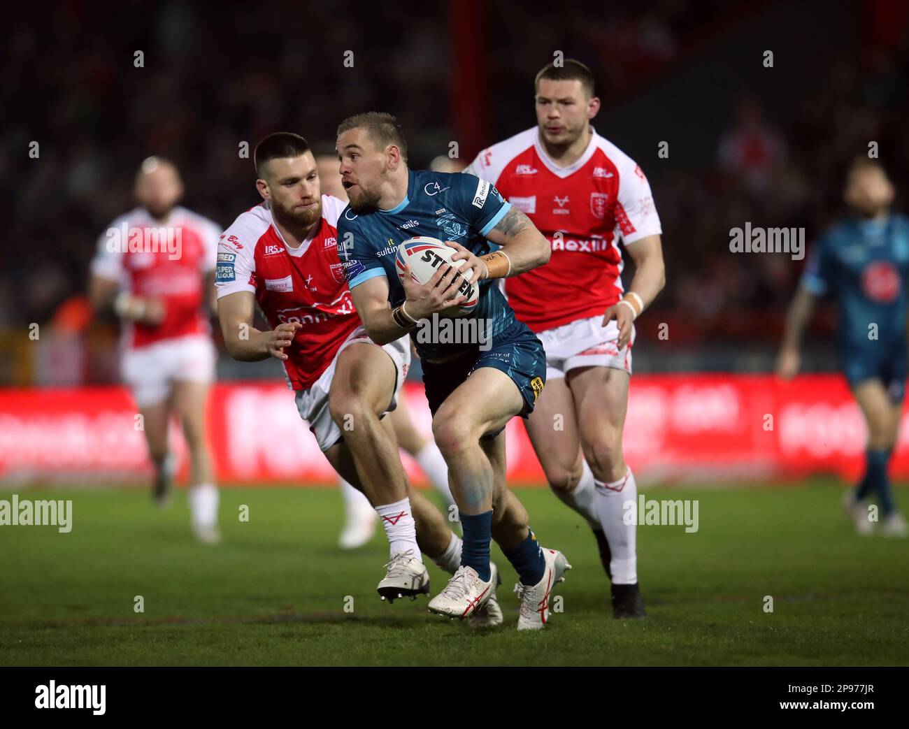 Warrington Wolves' Matthew Dufty (centre) in action during the Betfred ...