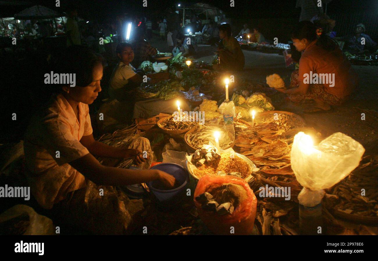 Myanmar vendors wait for customers in Yangon, Myanmar, Tuesday, Jan. 27 ...