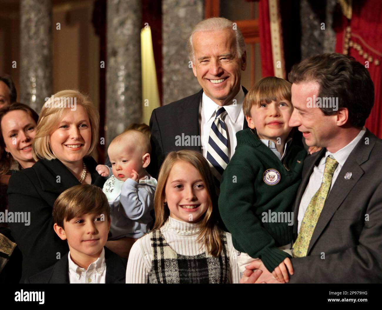 Sen. Kirsten Gillibrand, D-N.Y., second from left, holds her son, Henry ...
