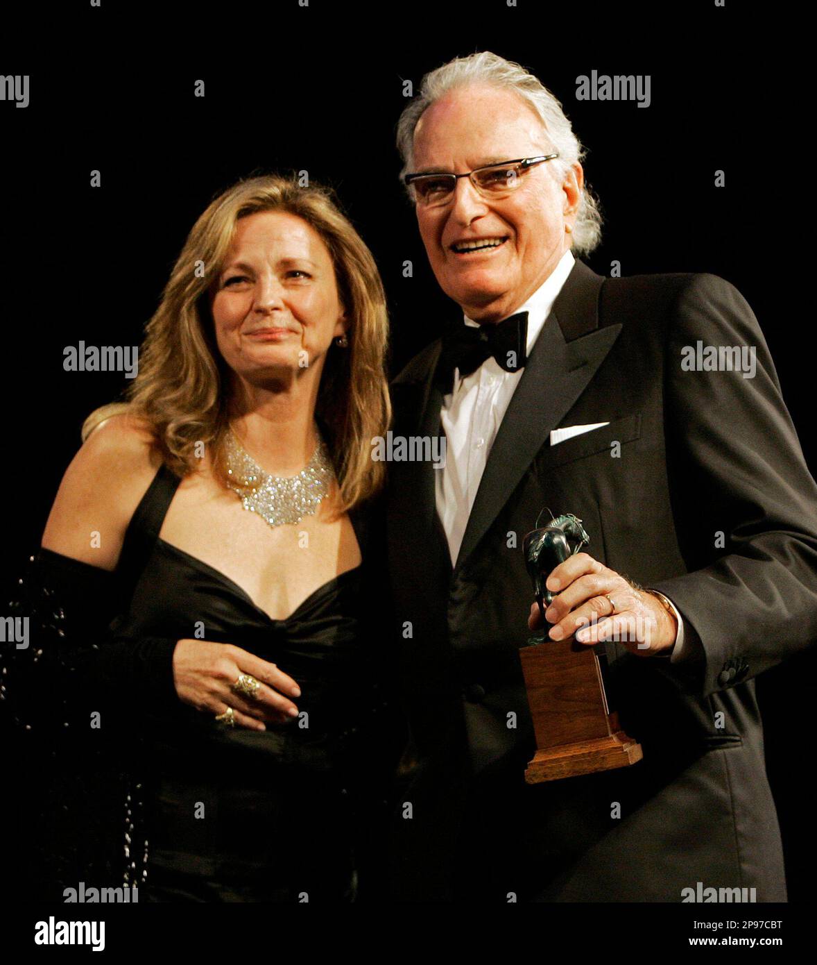 Jerry Moss and his wife Ann walk off the stage at the 38th Annual ...