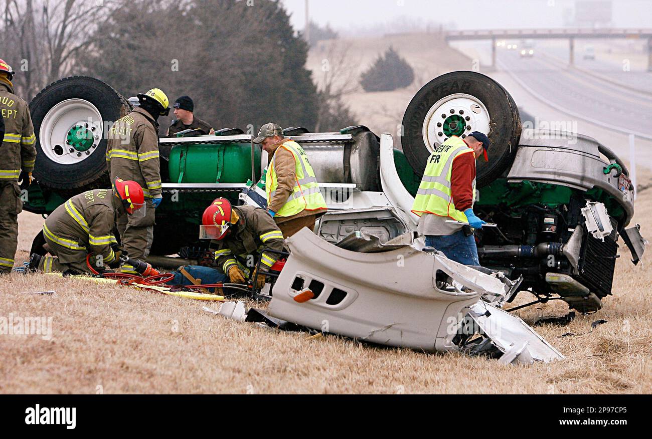 Stroud and Davenport firefighters work with the driver of this truck ...