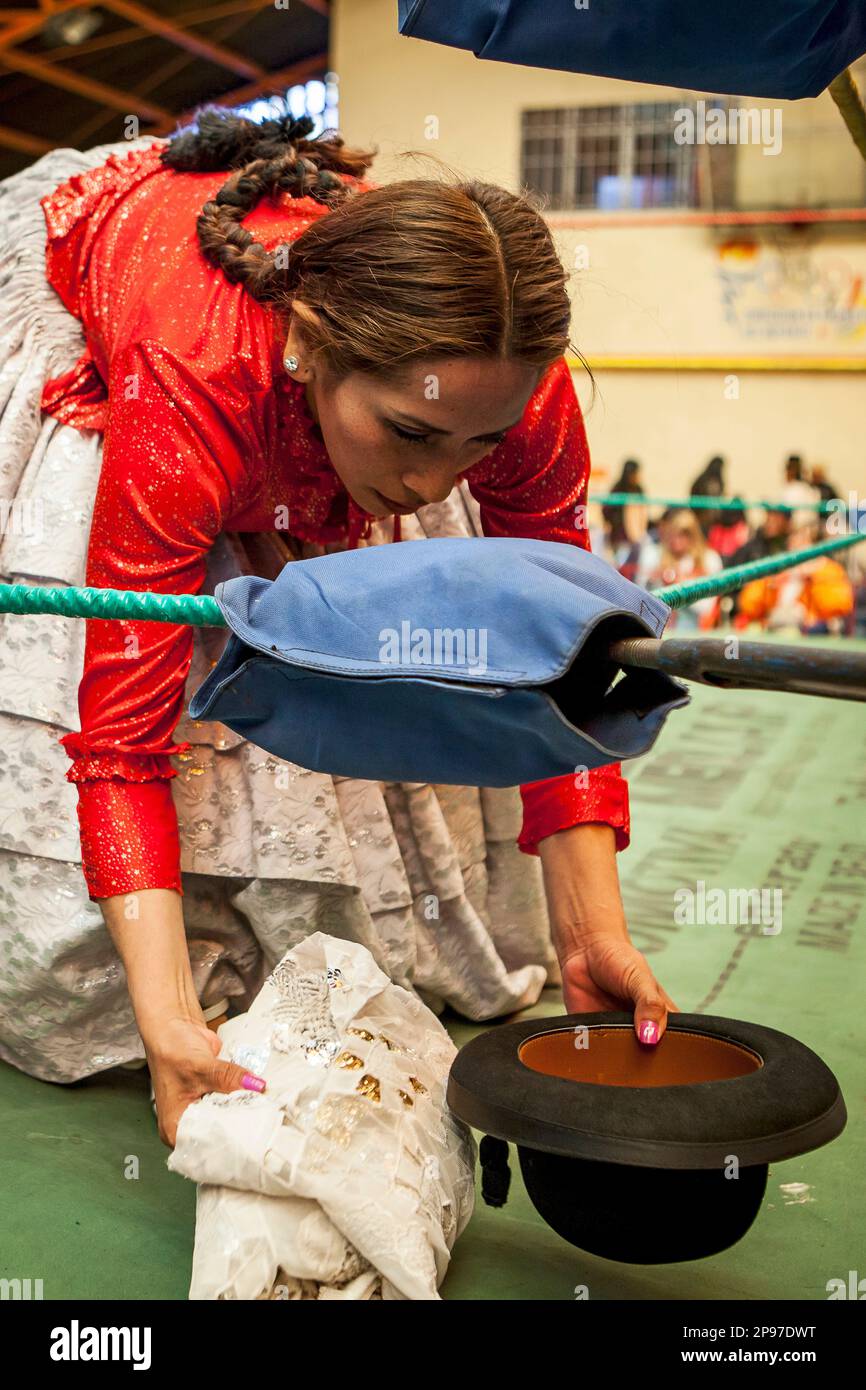 Lucha Libre. Benita la Intocable takes off the hat and shawl to start ...