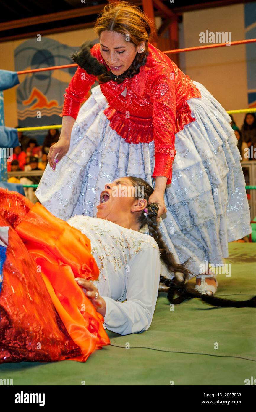 Lucha Libre. Combat between Dina with orange skirt and Benita la ...