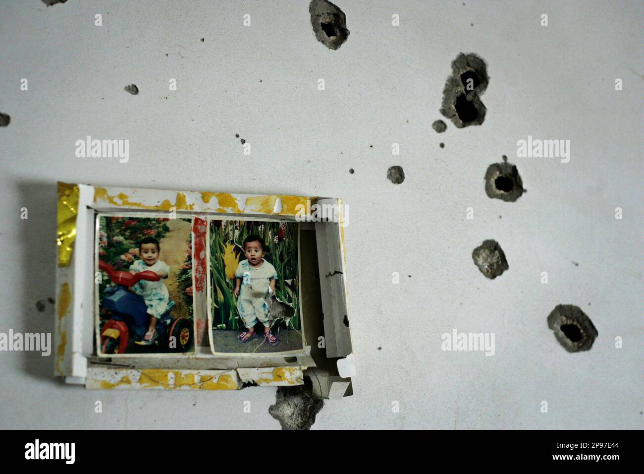 ** FILE ** Pictures of Palestinian Mohammed Zayid's grandson Muataz are ...