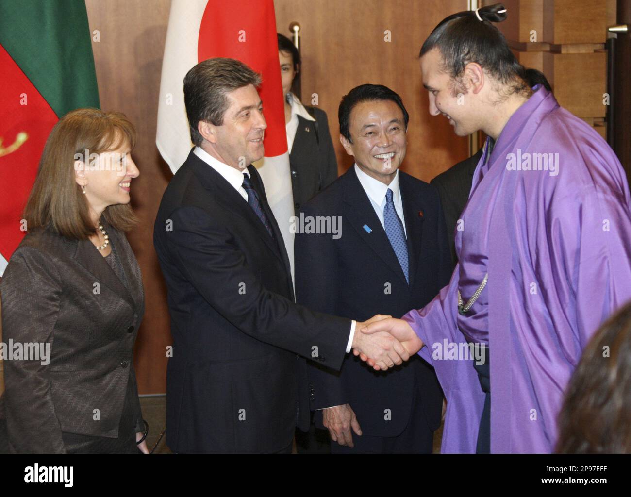 Bulgarian President Georgi Parvanov, second from left, shakes hands ...