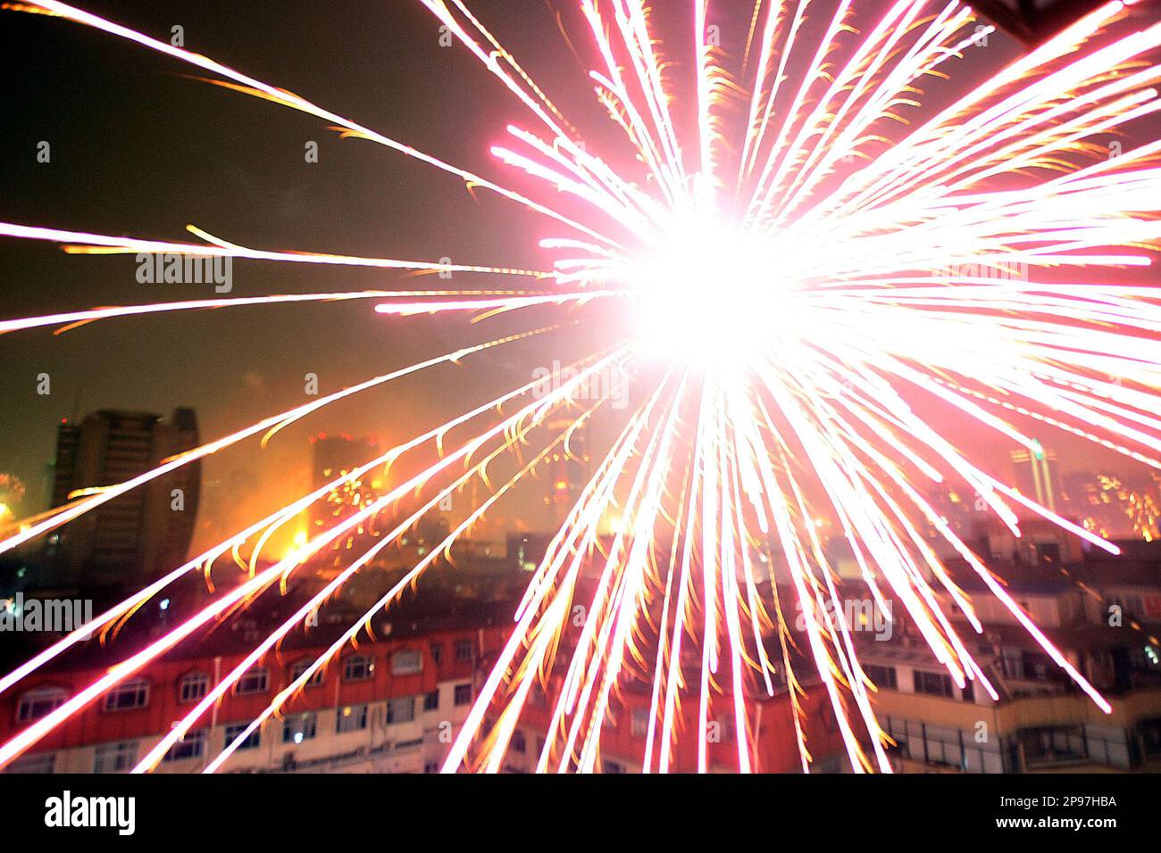 People launch fire works to celebrate the Chinese new year in the ...