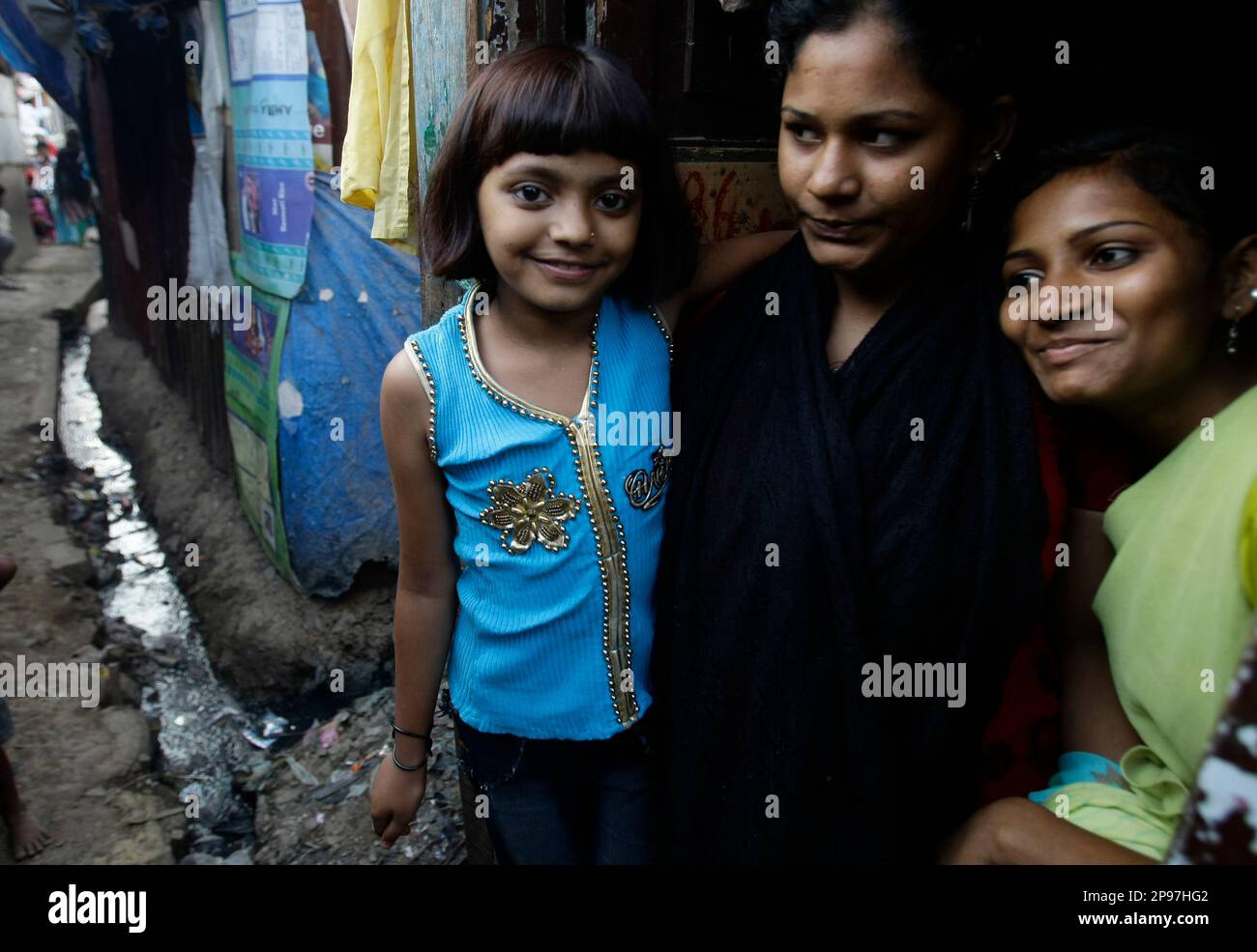 Rubina Ali Qureshi, 9, left, poses with her friends Farah Qureshi, 17 ...