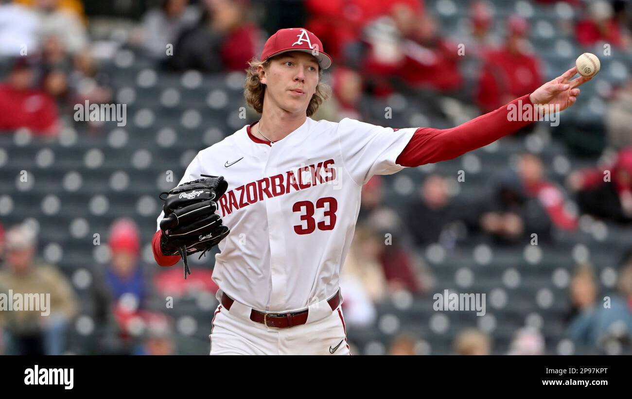 Arkansas pitcher Hagen Smith (33) throws to first base against Eastern Illinois during an NCAA ...