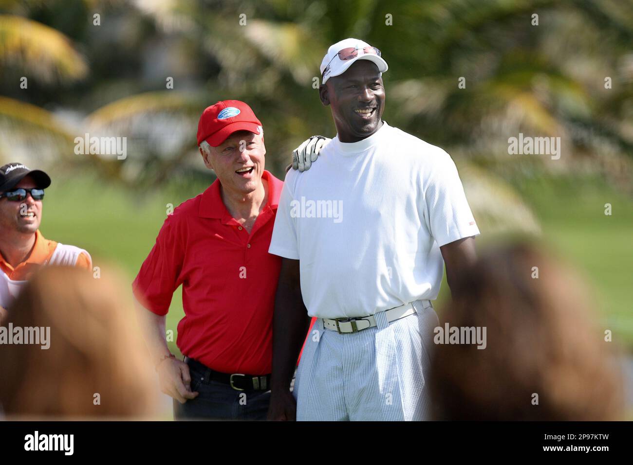 Former U.S. President Bill Clinton,center, shares a laugh with Michael ...