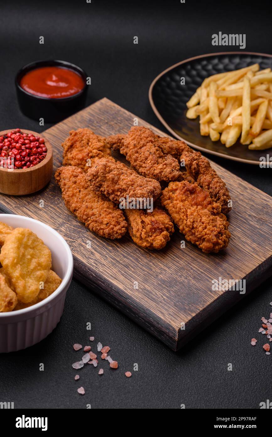 Delicious crispy breaded chicken wings grilled with spices and herbs on ...