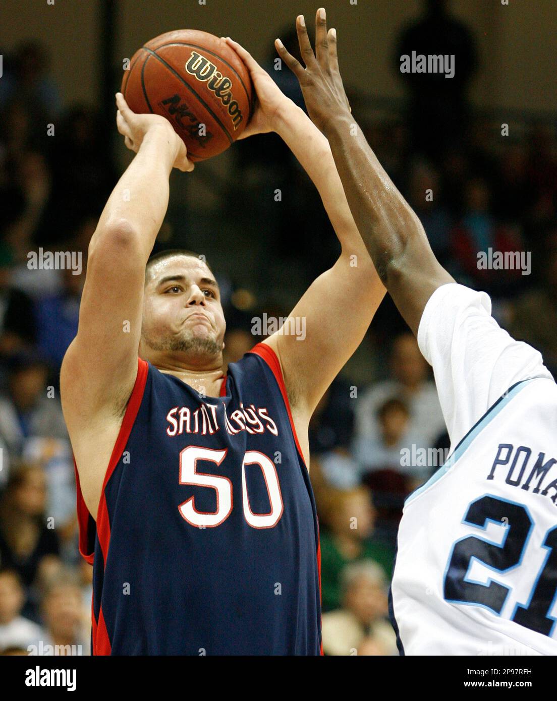 St. Mary's Omar Samhan (50) shoots over San Diego's Gyno Pomare (21 ...