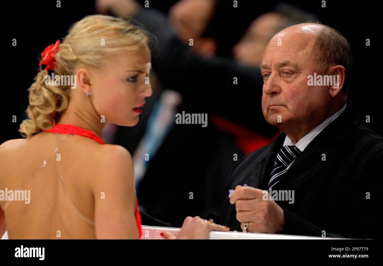 Russian coach Alexei Mishin, right, looks at Russia's Katarina Gerboldt ...