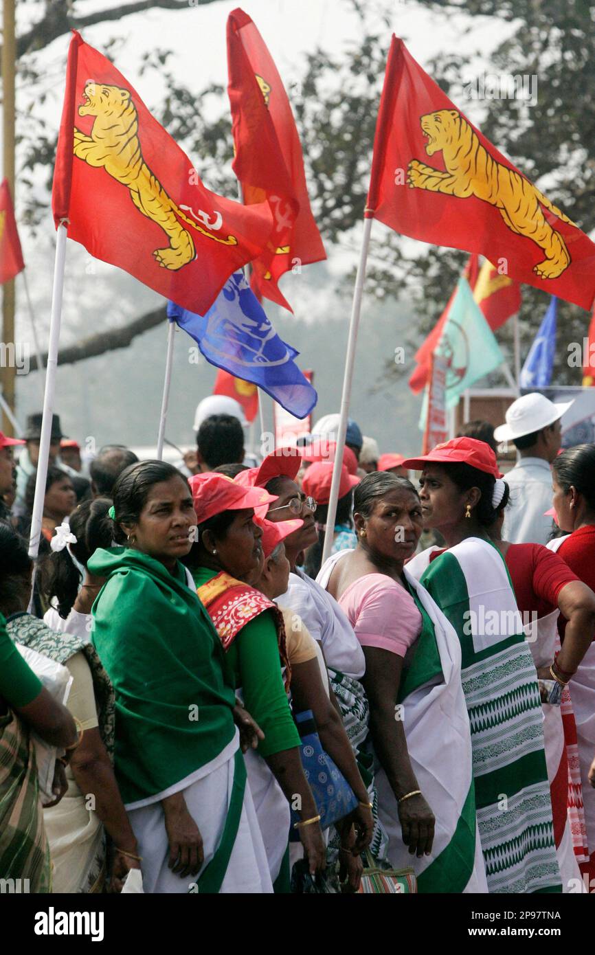 Indian women hold flags with the election symbol of the Forward Block ...