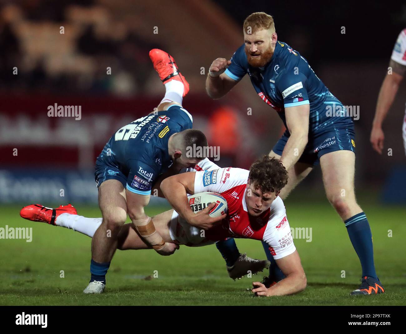 Warrington Wolves' Joe Philbin tackled by Hull Kingston Rovers' James ...