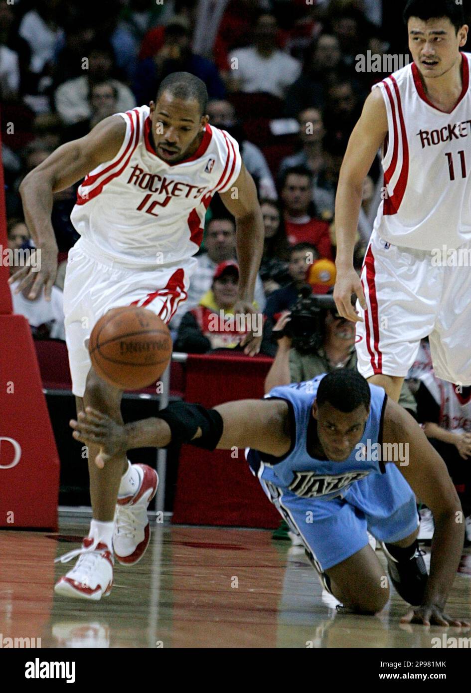 Houston Rockets' Rafer Alston (12) takes off with the ball against Utah ...