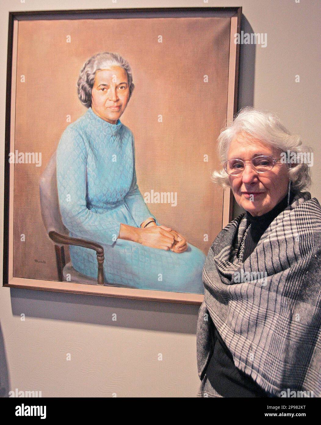 Leonore Templeton poses with a portrait of civil rights icon Rosa Parks ...