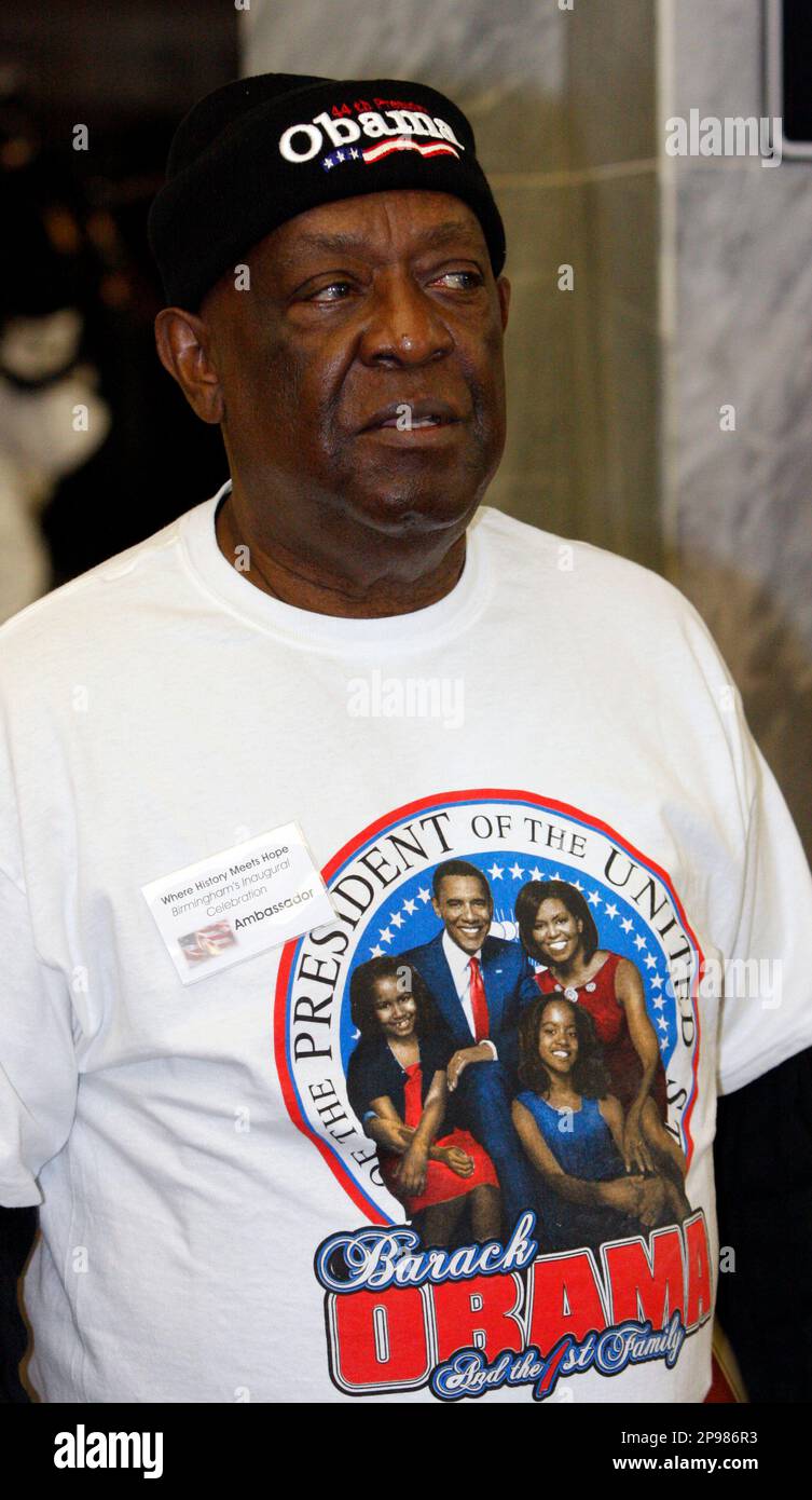 Ted Roberts,77, of Birmingham passed out flags at a gathering to watch ...