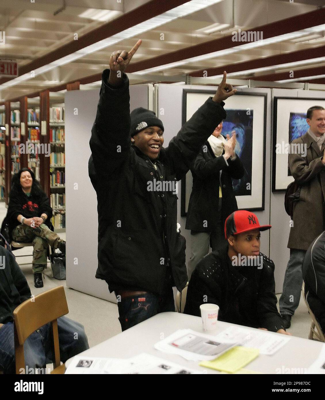 Timmy Wright smiles as he cheers after watching President Barack Obama ...