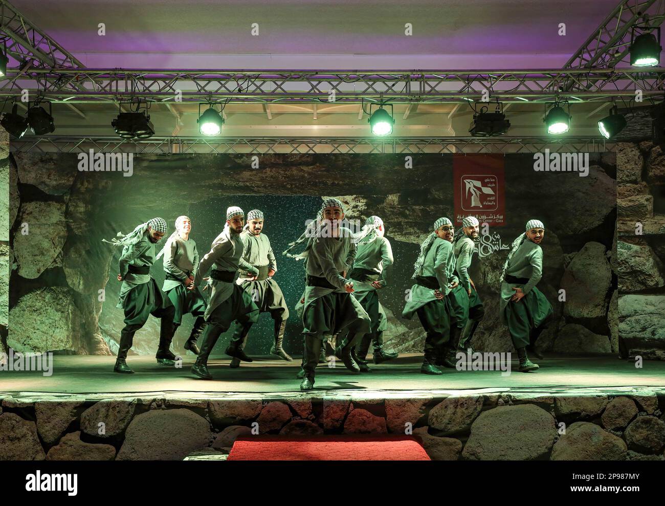 Palestinian youths perform Dabkeh dance during a celebration of ...