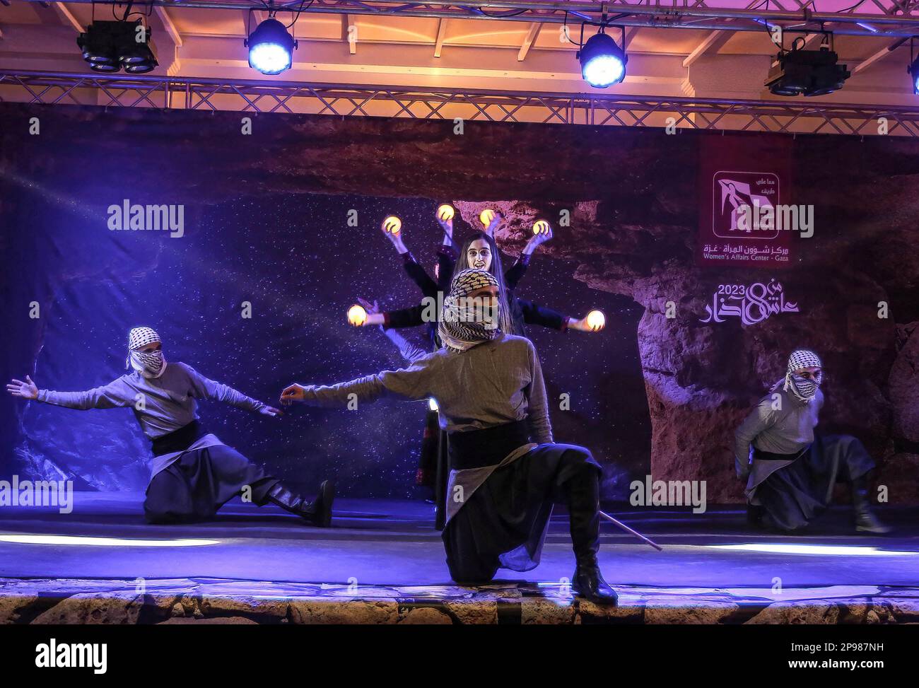 Palestinians perform Dabkeh dance during a celebration of International ...