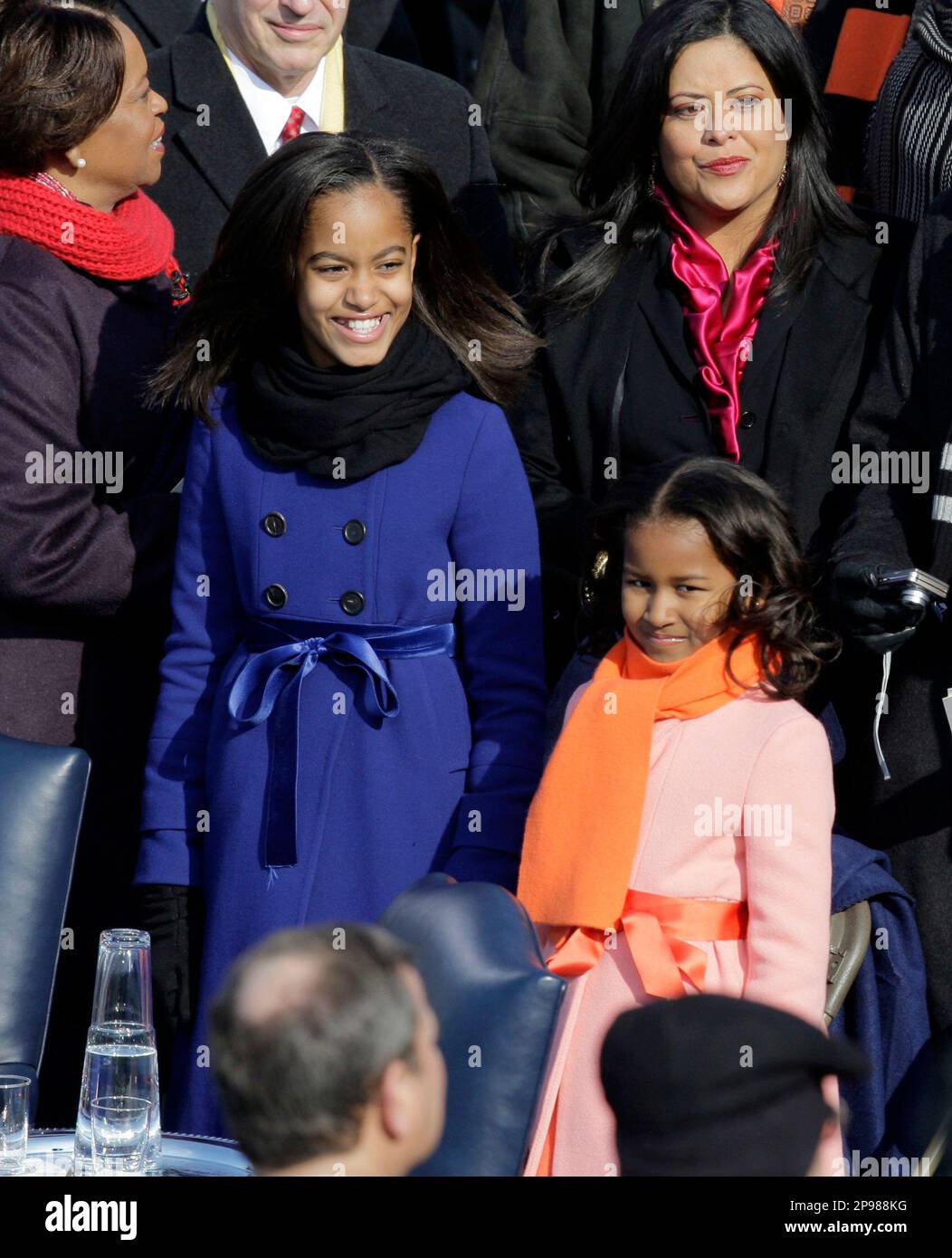 Maya Soetoro-Ng, sister of Barack Obama stands behind his daughters ...