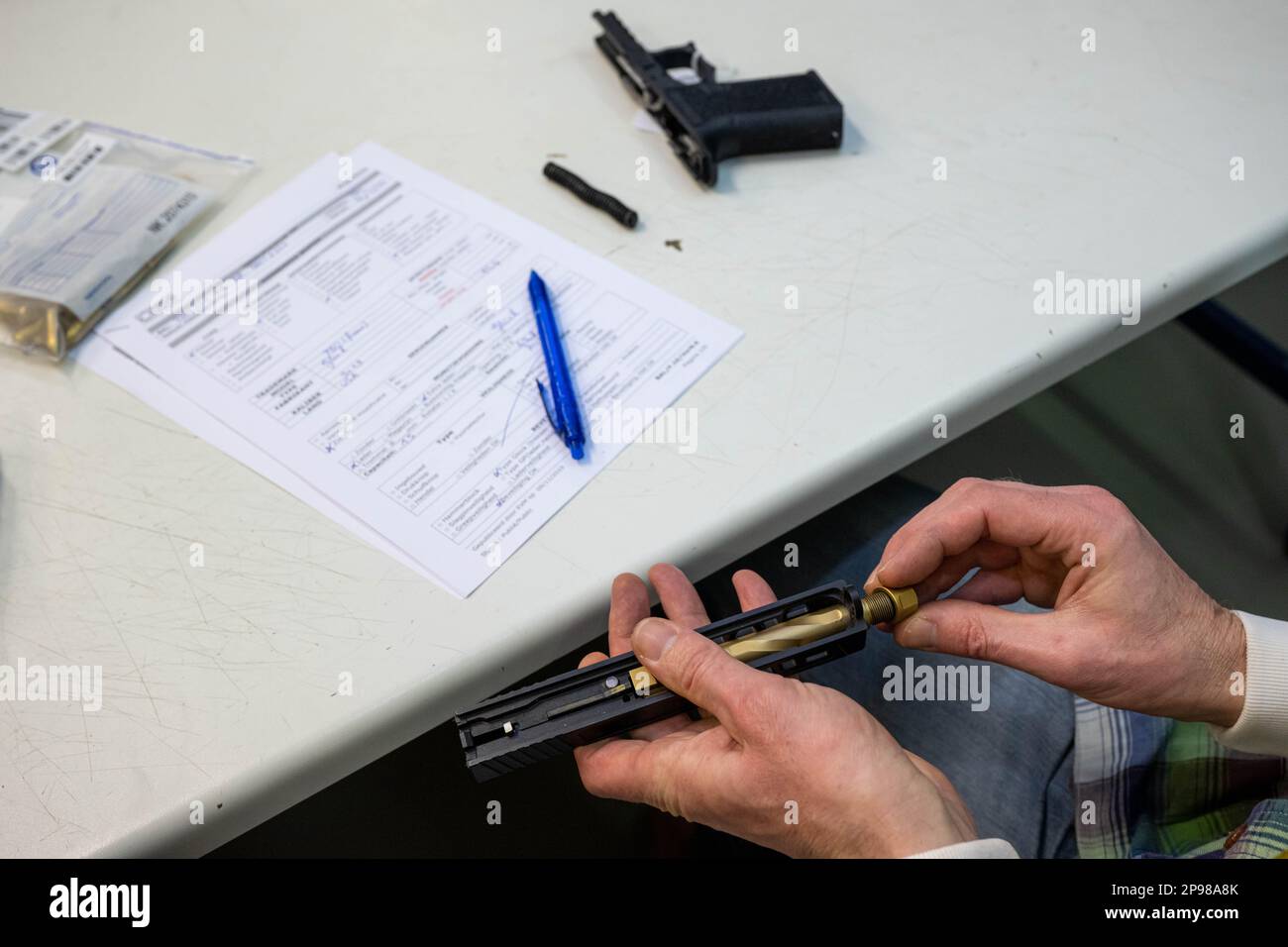 A handgun is seen in the ballistics laboratory during a visit to the ...