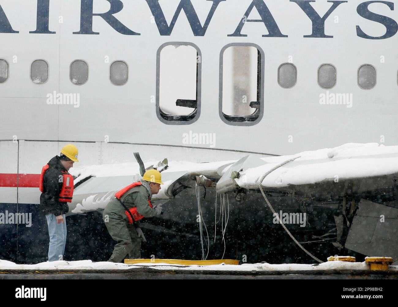 NTSB inspectors examine the left wing of US Airways Flight 1549 as it ...