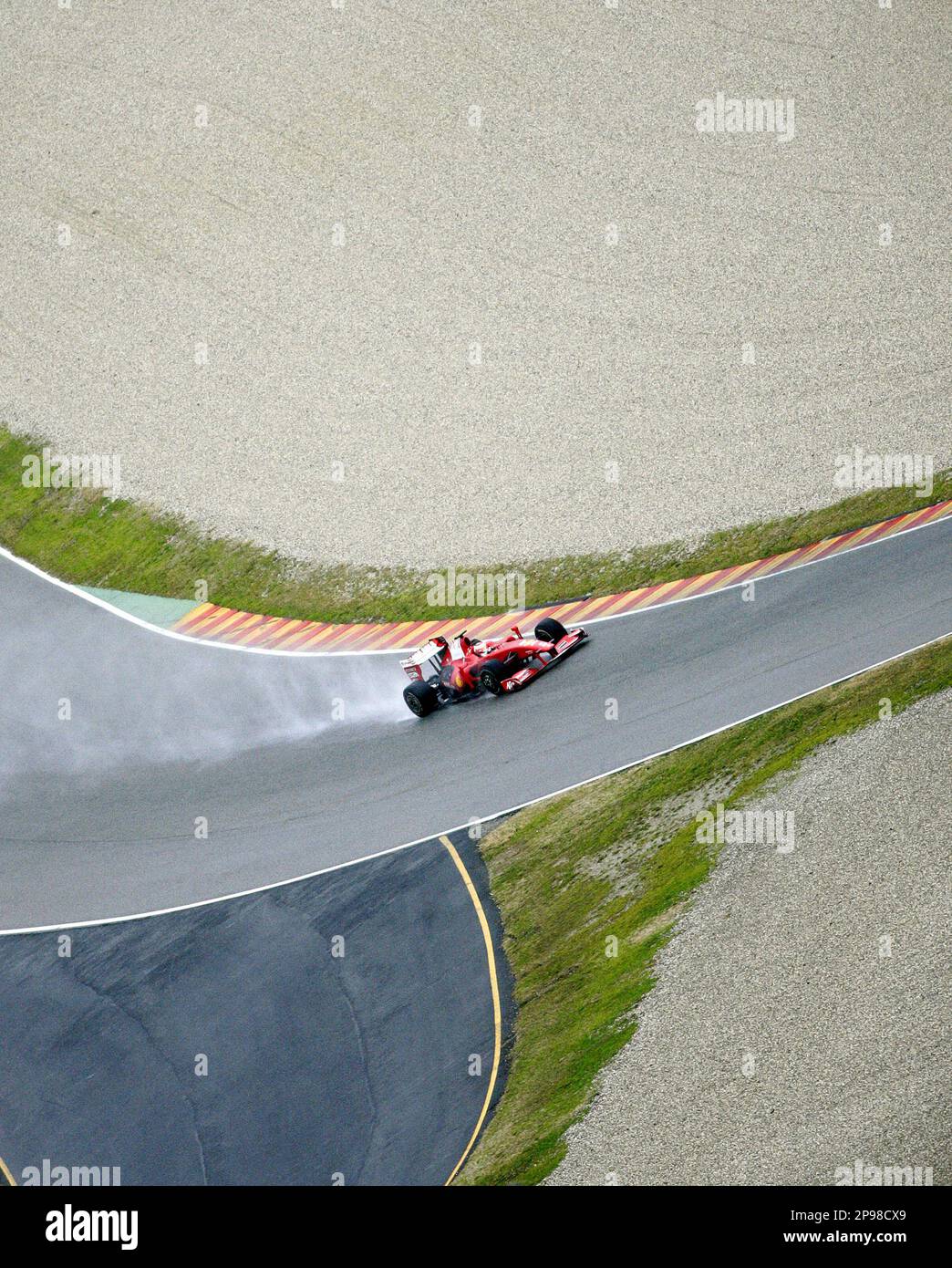Finnish driver Kimi Raikkonen steers the new Ferrari F60 Formula One ...