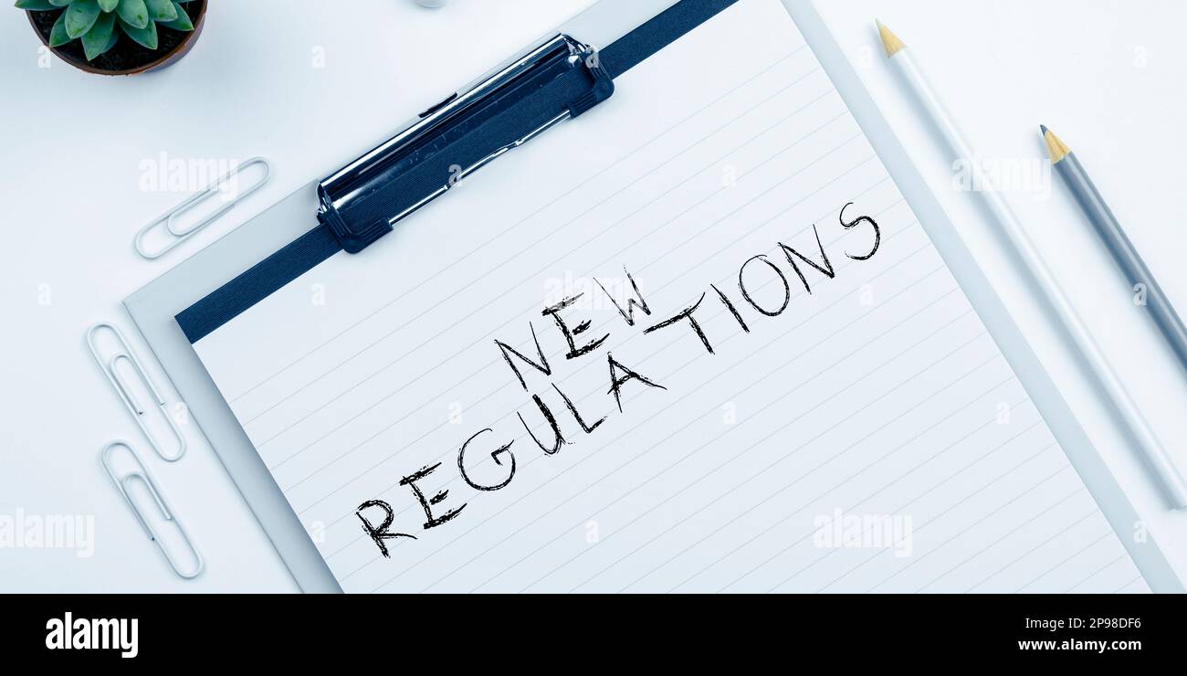 Hand writing sign New Regulations. Business concept Regulation ...