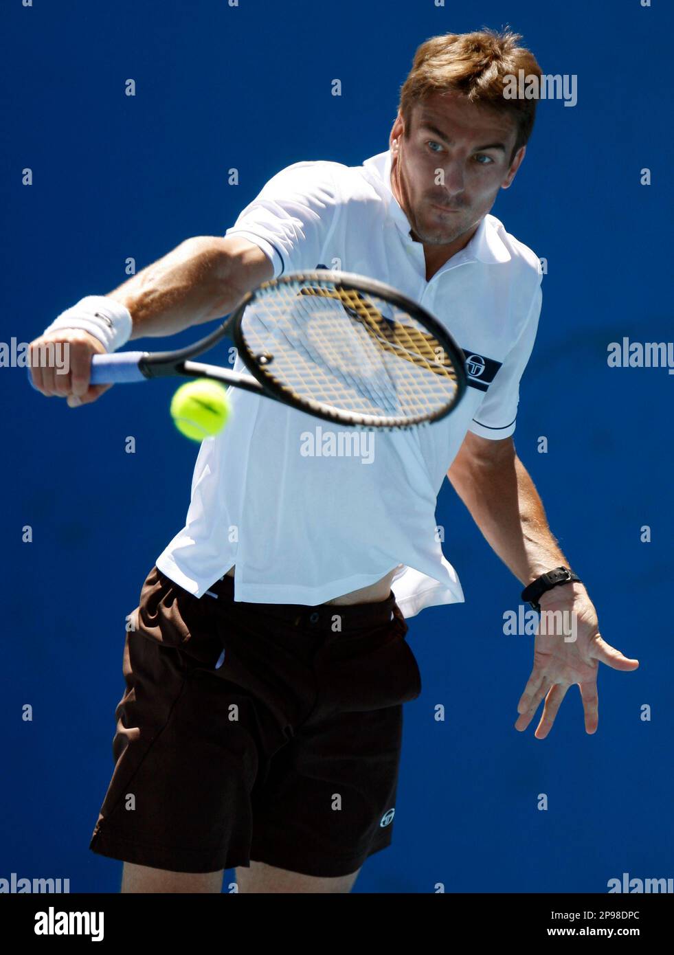 Spain's Tommy Robredo returns the ball to Bobby Reynolds of the U.S ...