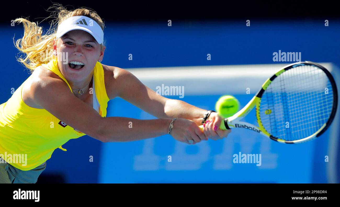 Denmark's Caroline Wozniacki returns the ball to Israel's Shahar Peer ...