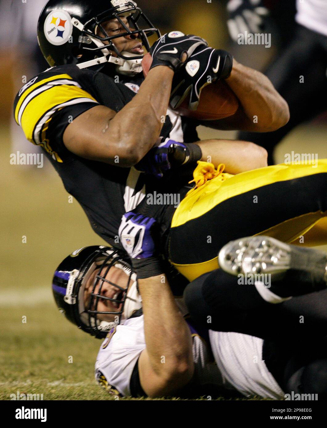 Pittsburgh Steelers running back Mewelde Moore, top, is brought down by ...