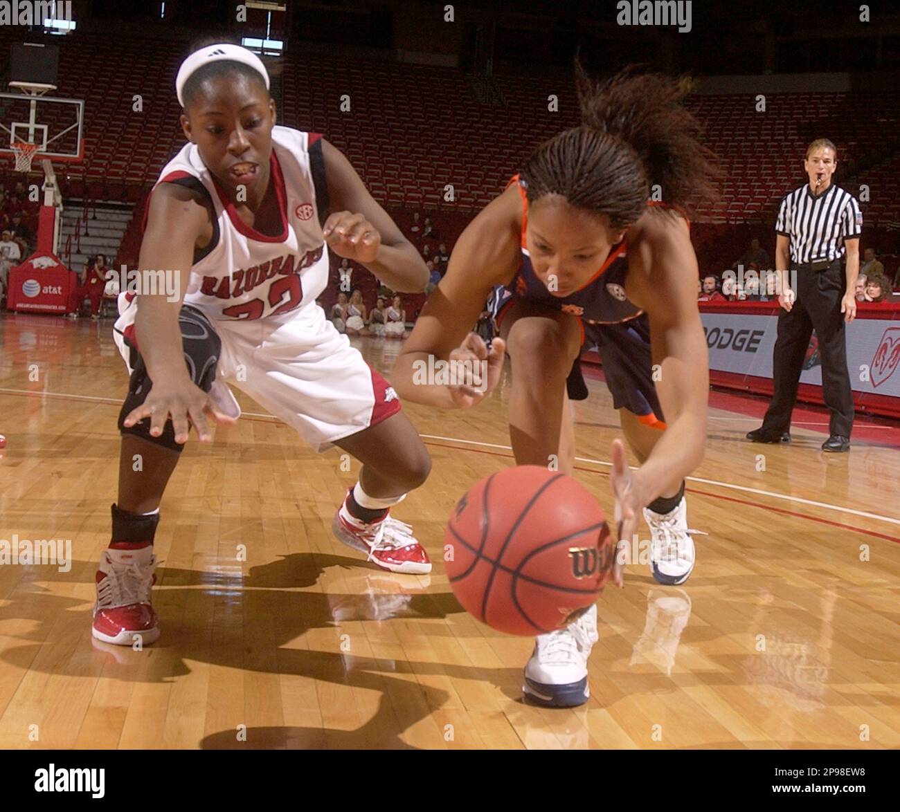 Arkansas' Ceira Ricketts, left, and Auburn's Sherell Hobbs (12) reach ...
