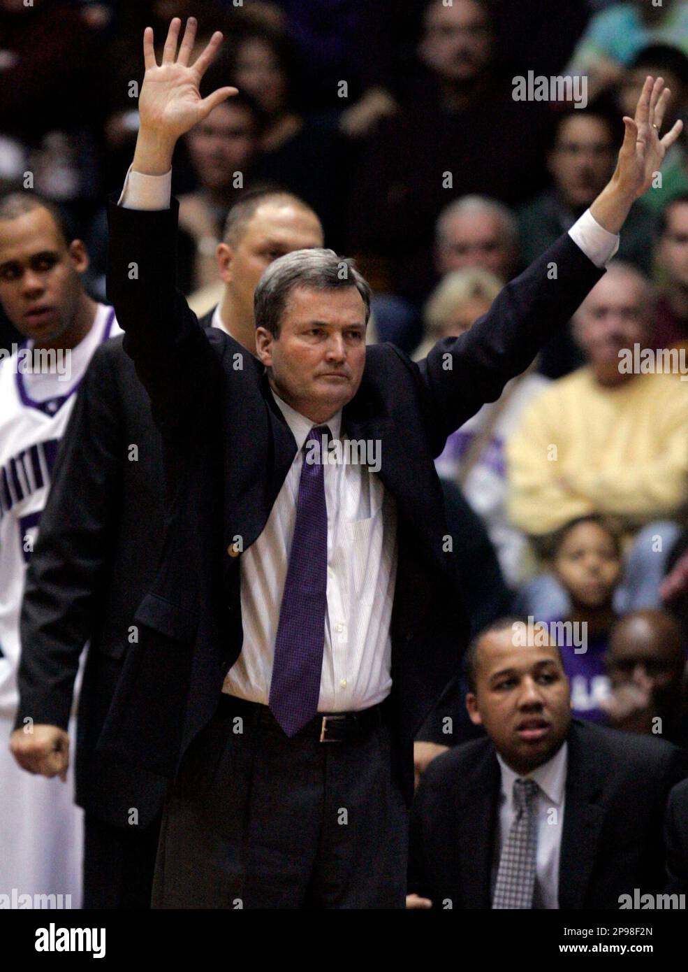 Northwestern head coach Bill Carmody signals to his players during the ...