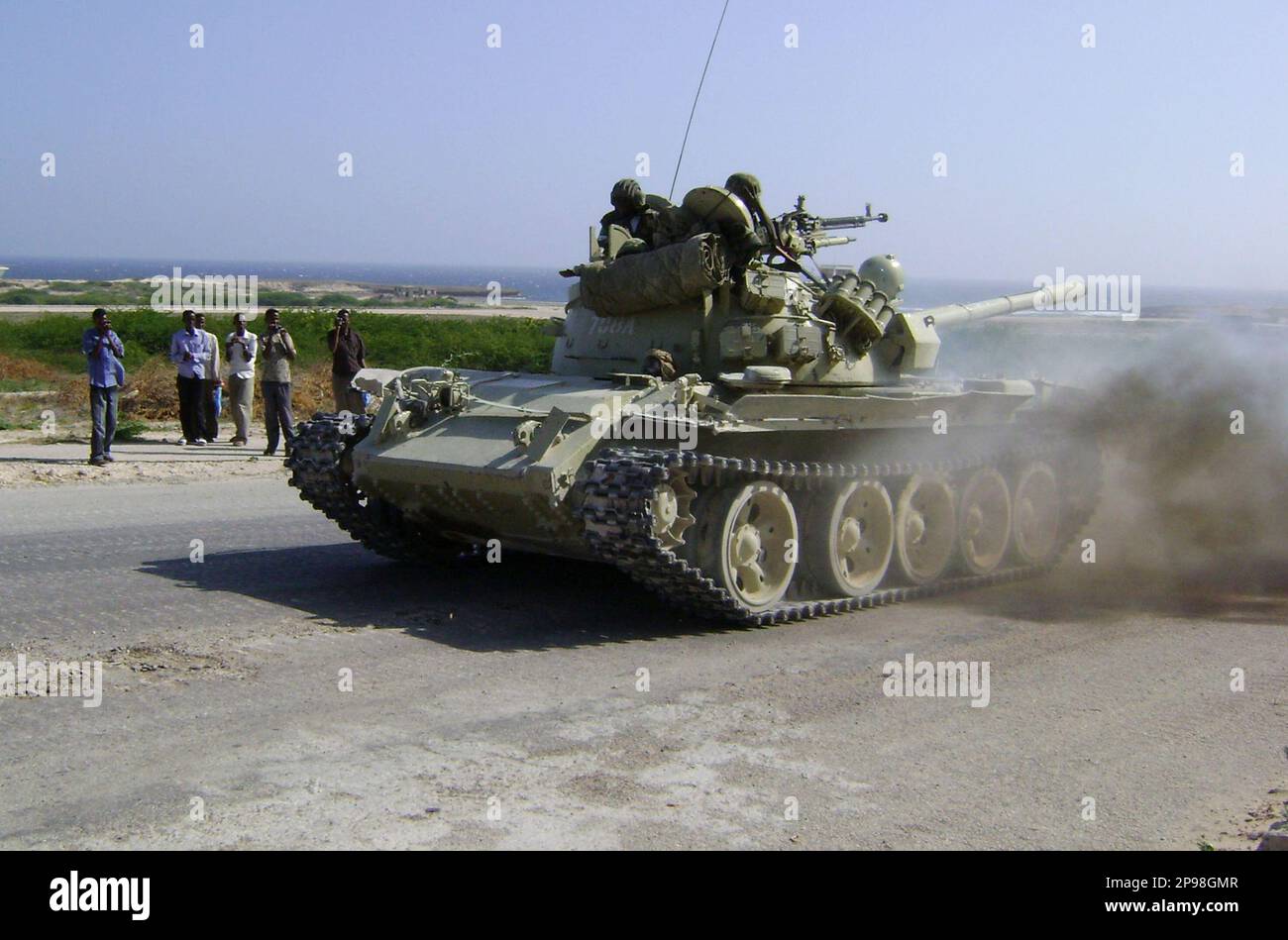 An African Union peacekeepers tank patrols the streets, Mogadishu ...