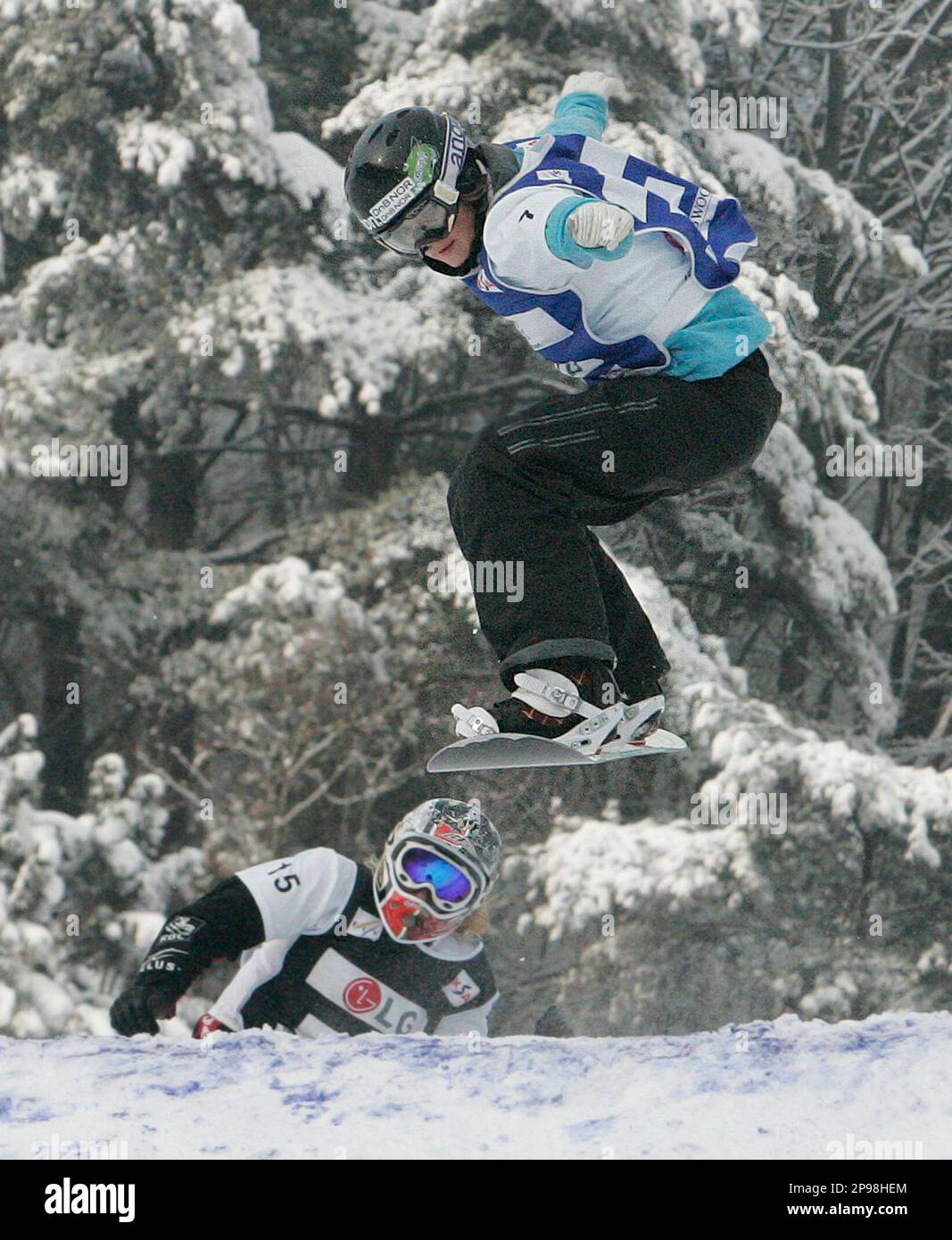 Gold medalist Helene Olafsen of Norway jumps, right, as Canada's ...